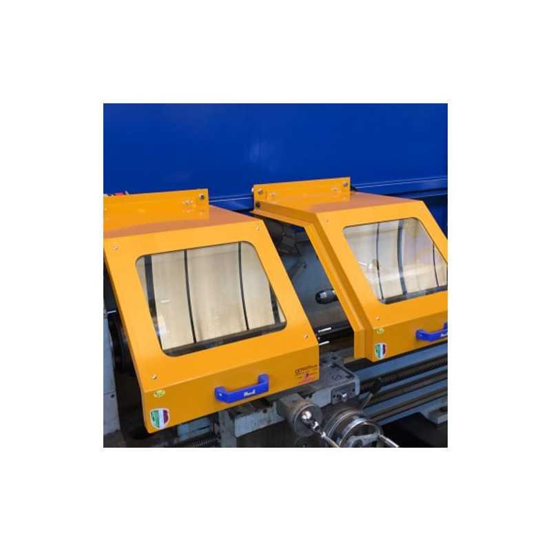 Double sliding safety guard for chuck and saddle of a lathe in ...